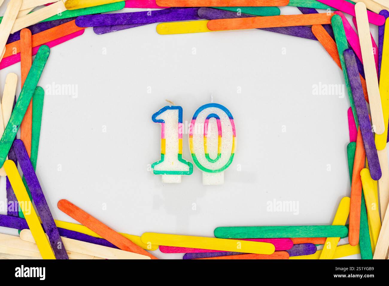 Number 10 shape birthday candles in a colorful popsicle sticks frame ...
