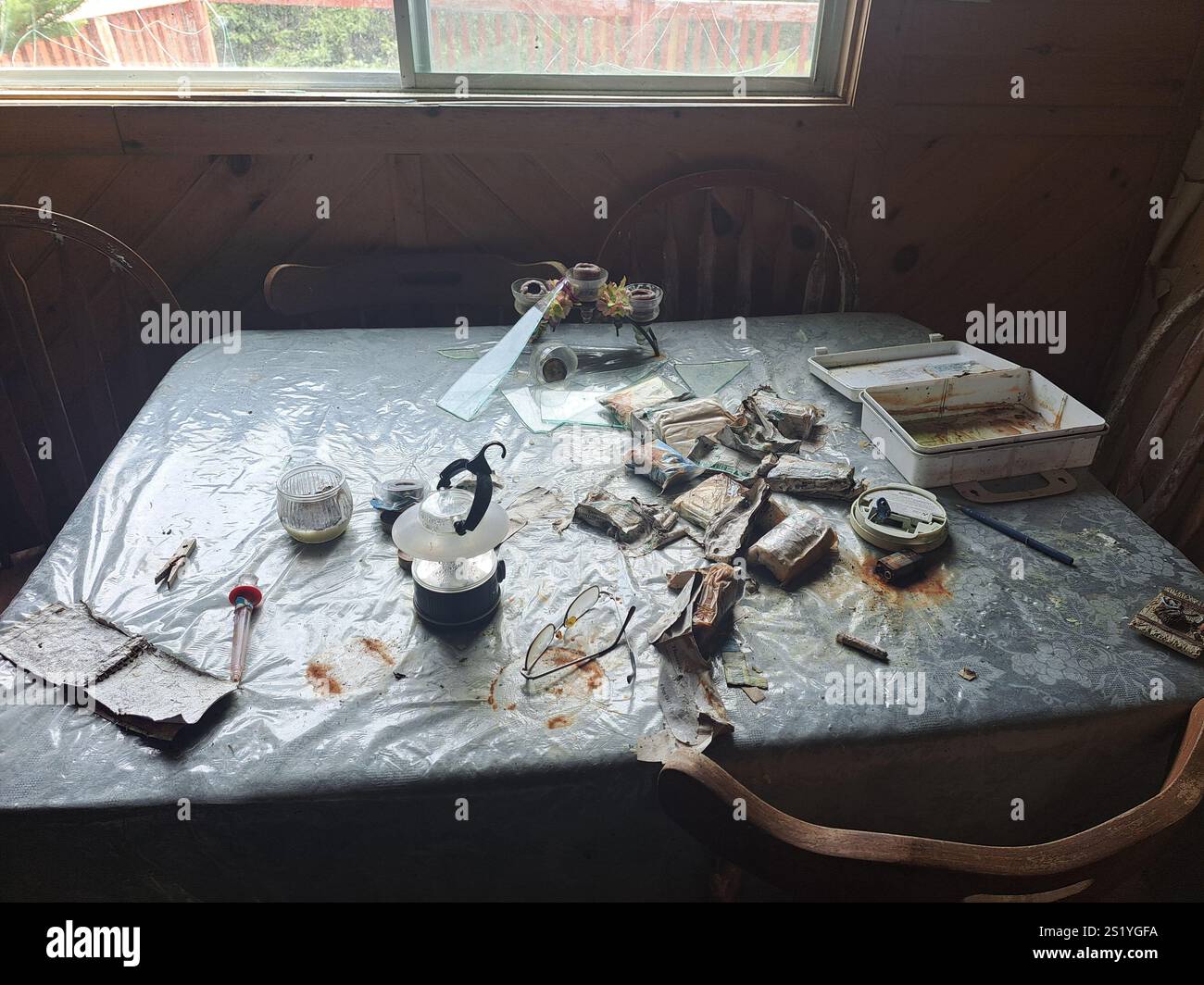 Kitchen table and chair inside abandoned dilapidated cabin in Pouch ...
