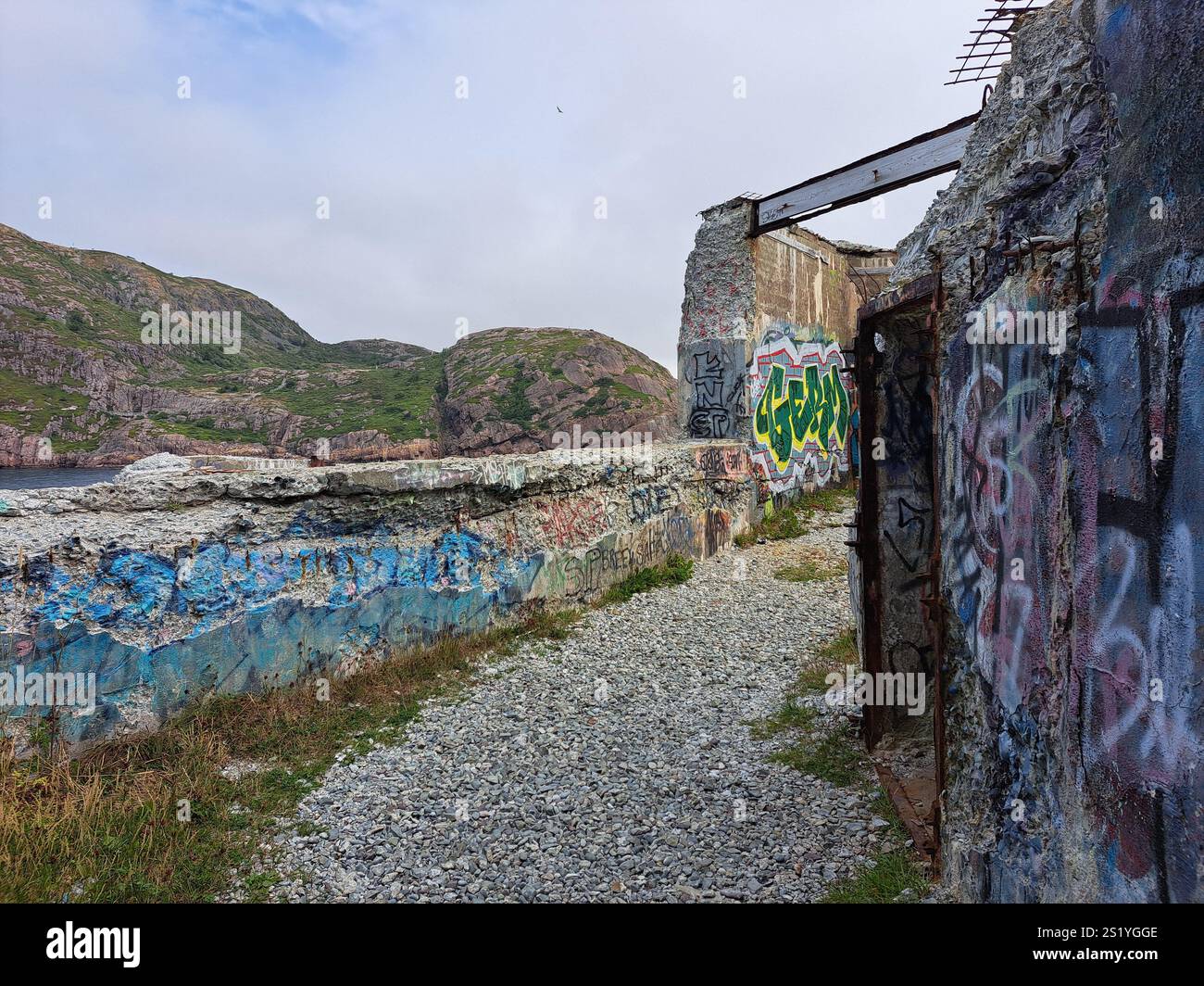 Crumbling concrete and rusty rebar at the abandoned dilapidated WWII ...