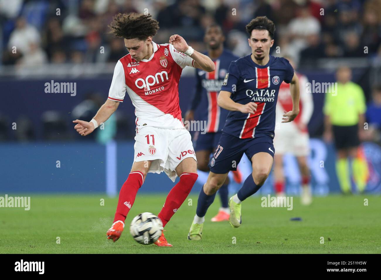 Monaco's Maghnes Akliouche shoots by PSG's Vitinha during the French ...