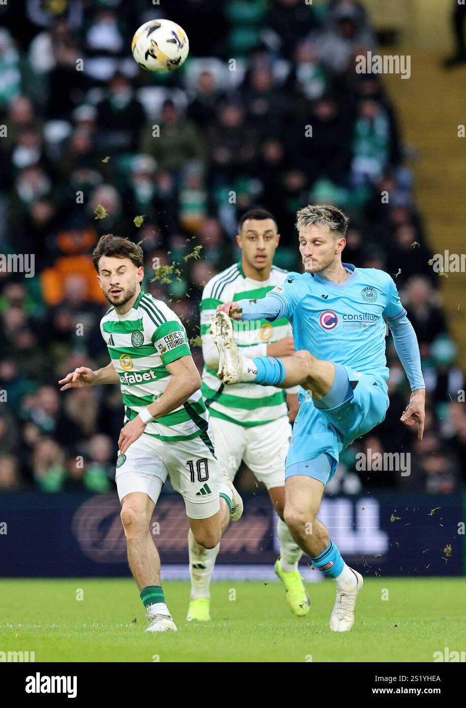 Celtic's Nicolas Kuhn (left) and St Mirren's Scott Tanser battle for ...