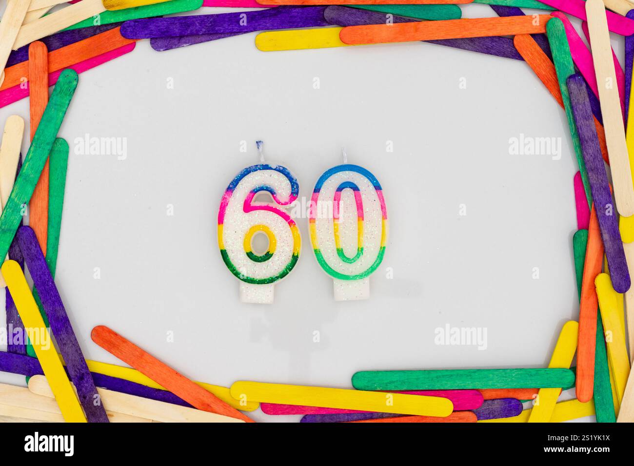 Number 60 shape birthday candles in a colorful popsicle sticks frame ...