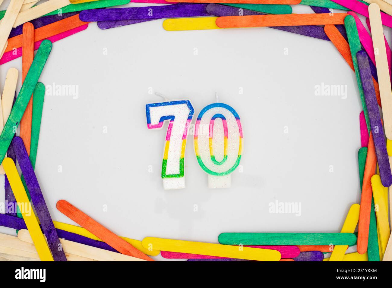 Number 70 shape birthday candles in a colorful popsicle sticks frame ...