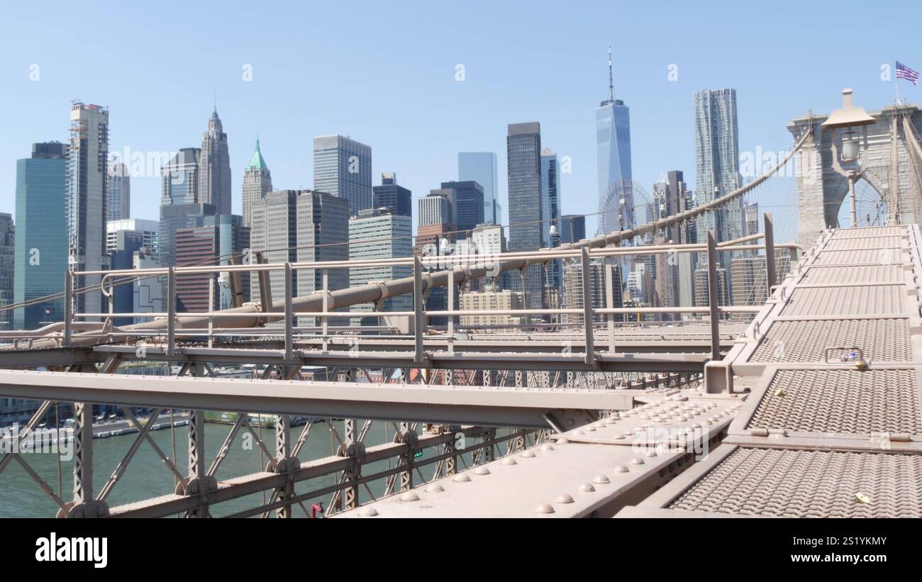 Brooklyn Bridge to Manhattan downtown. New York City skyline, financial ...