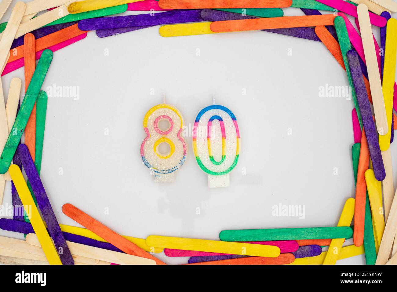 Number 80 shape birthday candles in a colorful popsicle sticks frame ...