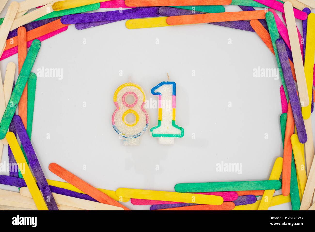 Number 81 shape birthday candles in a colorful popsicle sticks frame ...