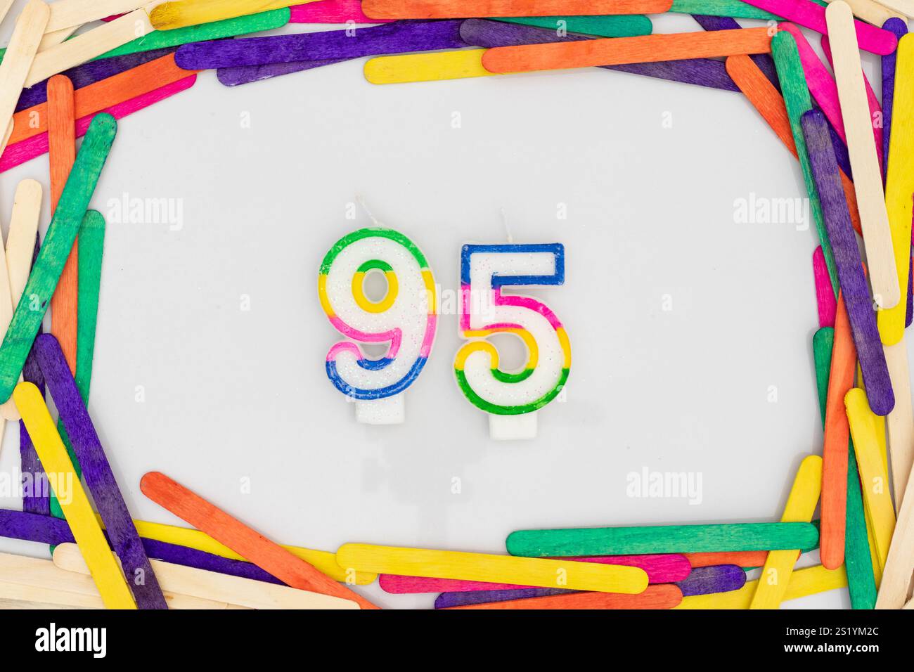 Number 95 shape birthday candles in a colorful popsicle sticks frame ...