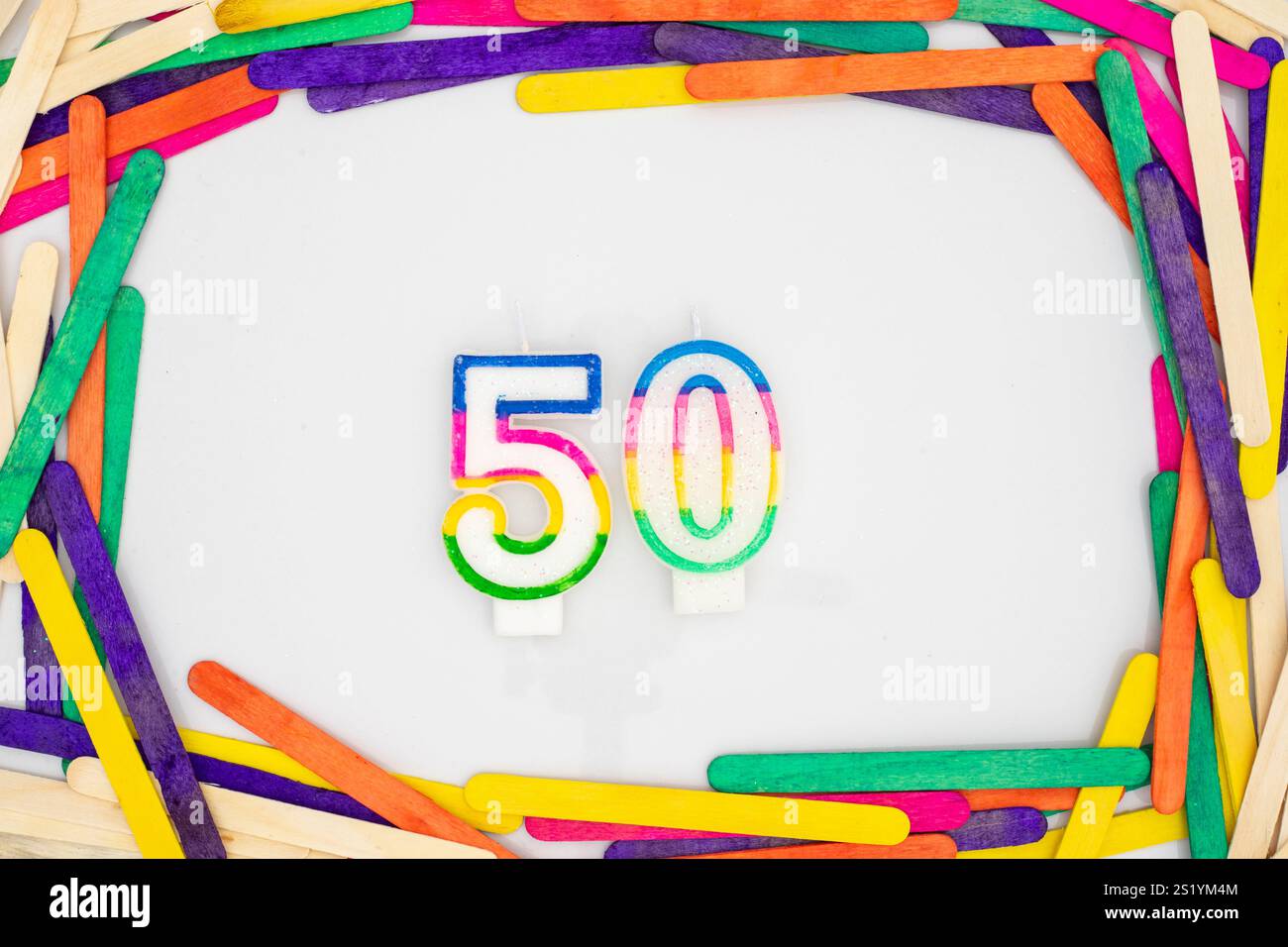 Number 50 shape birthday candles in a colorful popsicle sticks frame ...