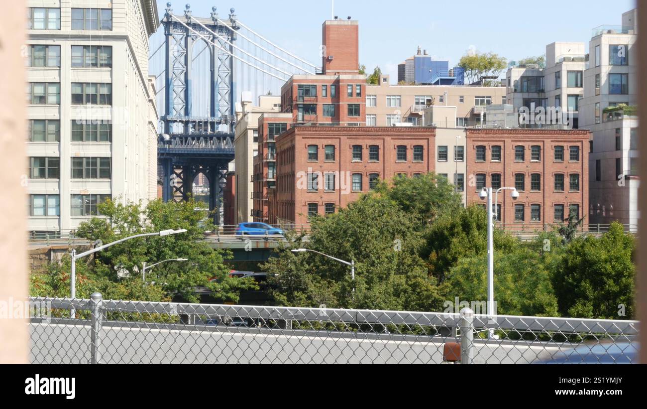 New York City Manhattan Bridge view from Brooklyn Bridge. Red brown ...