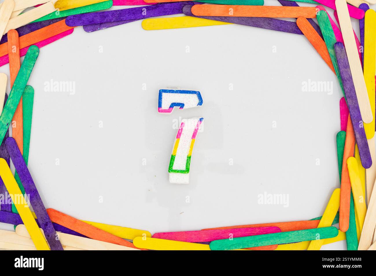 Seven numerical number shape rainbow colors candle cut in two pieces ...