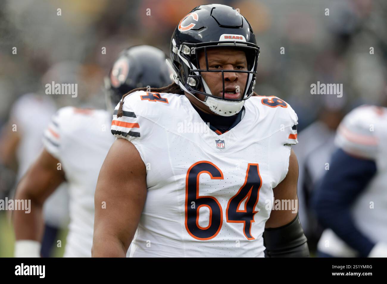 Chicago Bears defensive tackle Jonathan Ford (64) warms up before an ...