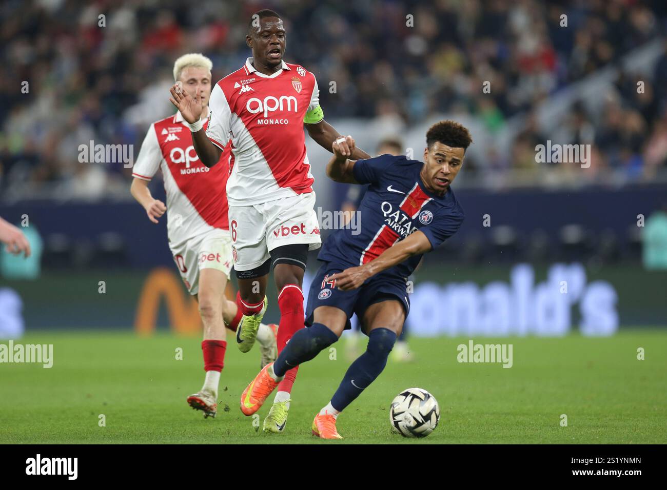 PSG's Desire Doue in action in front of Monaco's Denis Zakaria during ...