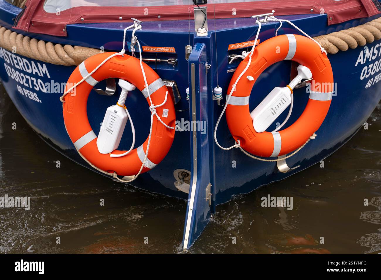 Lifebuoys with signal buoys, on a canal boat in Amsterdam, Netherlands ...