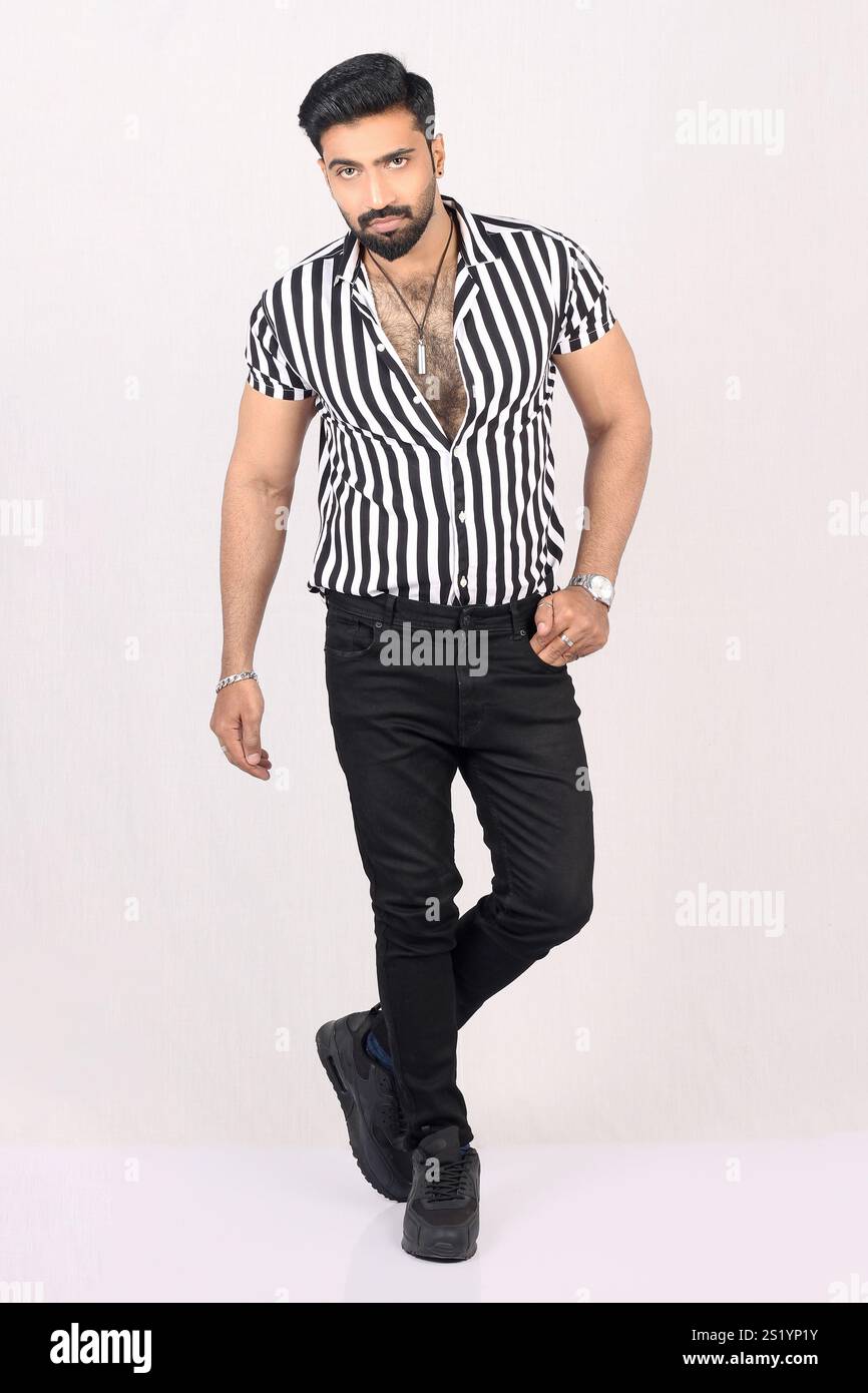 Portrait of an indian young male model in stripe shirt resemble in ...