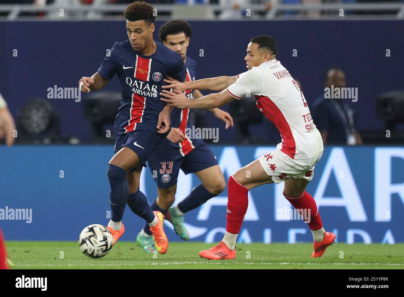 PSG's Desire Doue, left, and Monaco's Vanderson fight for the ball ...