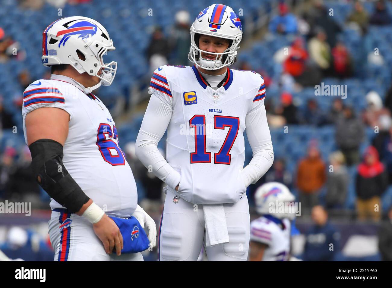 Buffalo Bills quarterback Josh Allen (17) walks with guard Connor ...