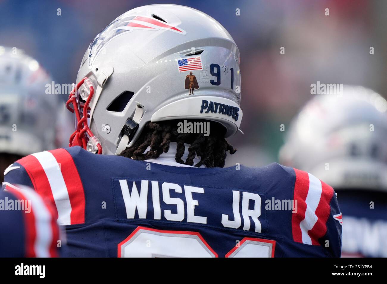 New England Patriots defensive end Deatrich Wise Jr. walks on the field ...