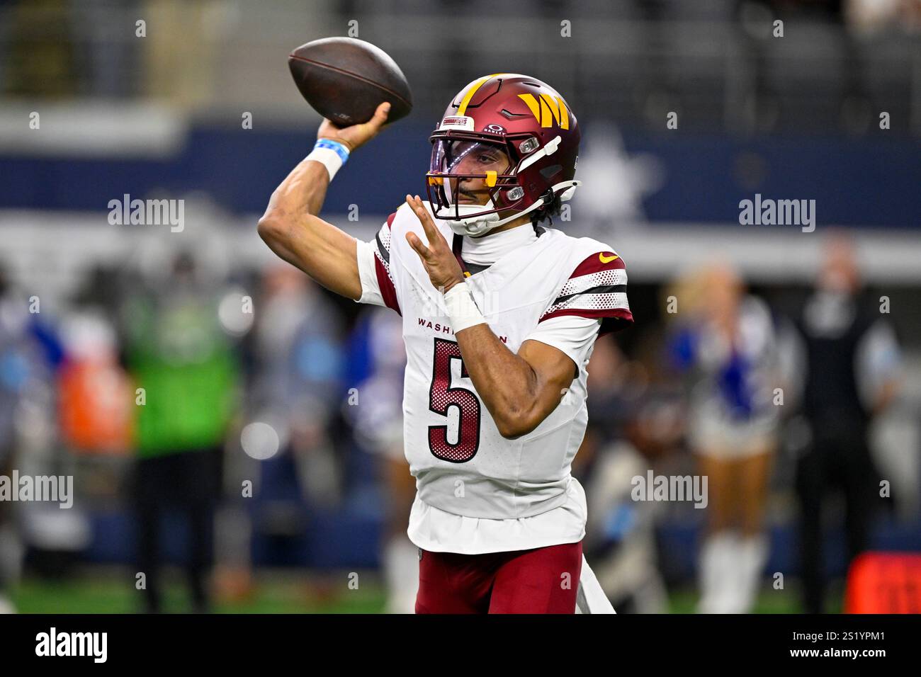Washington Commanders quarterback Jayden Daniels throws a pass against ...