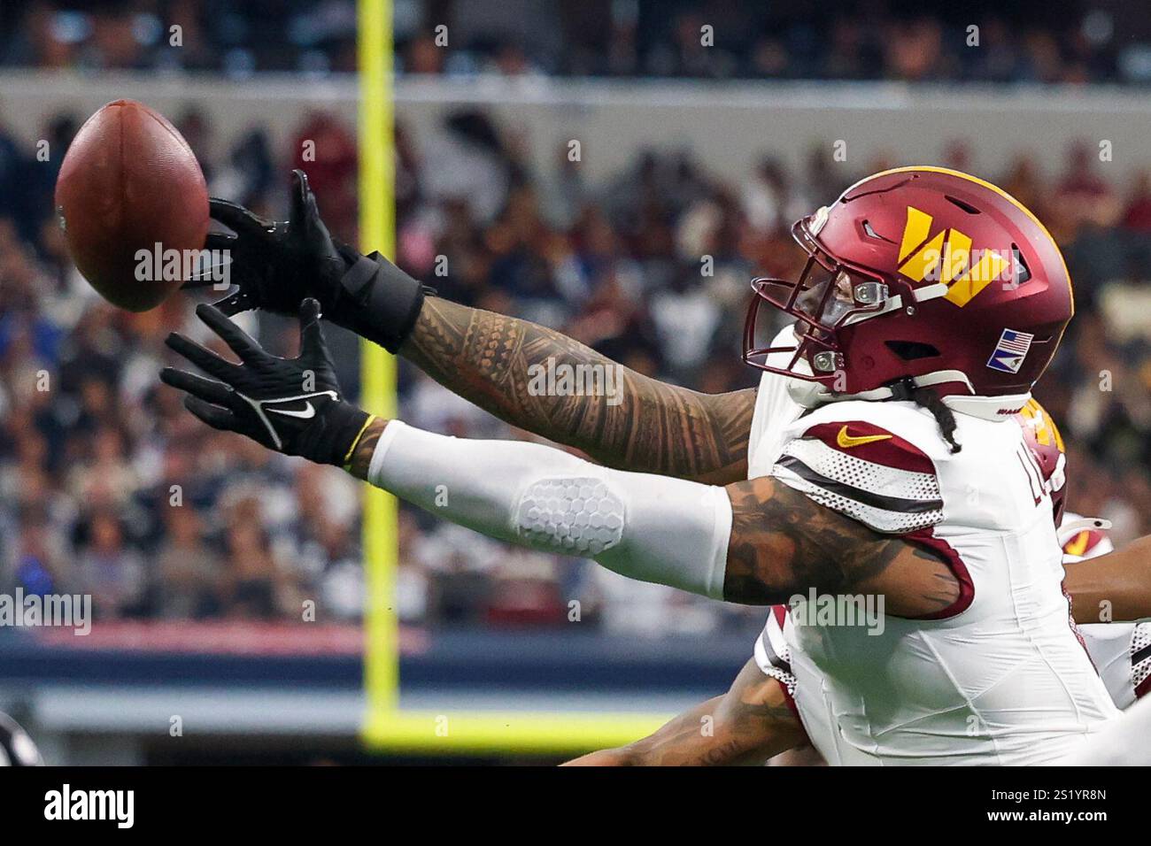 Washington Commanders linebacker Frankie Luvu tries to intercept a pass ...