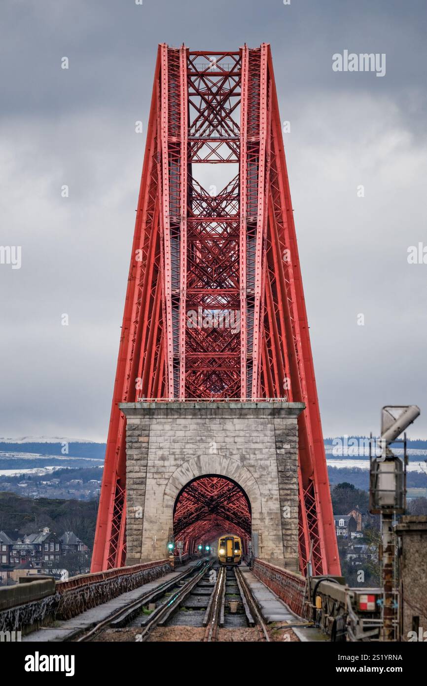 A commuter train crossing the Forth Bridge from North to South ...