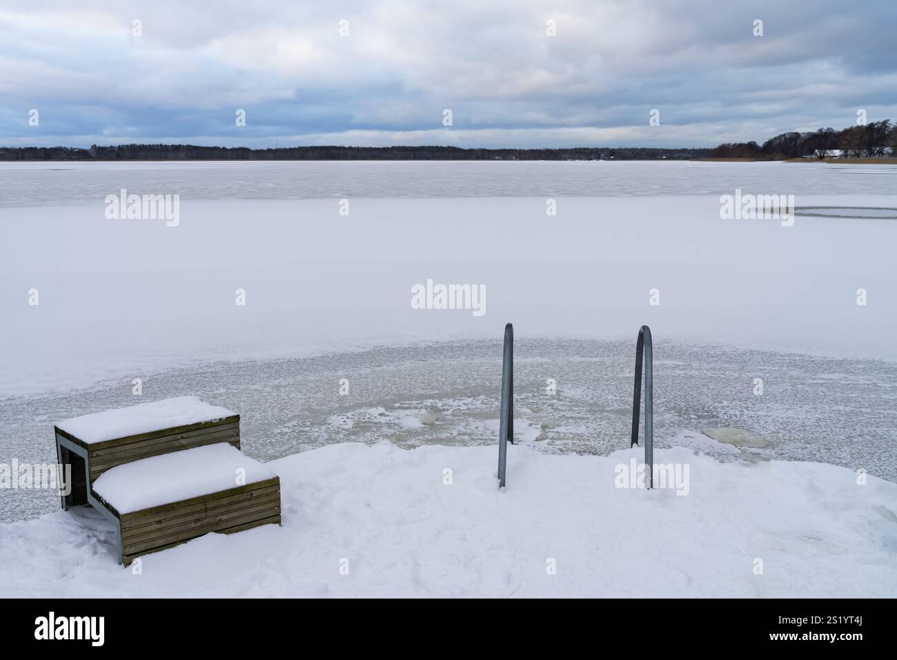 A ladder into an ice hole for winter swimming. Hardening, winter ...