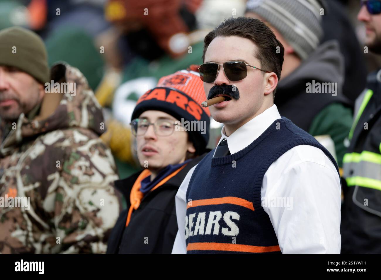 A fan dressed as former head coach Mike Ditka watches during the first ...