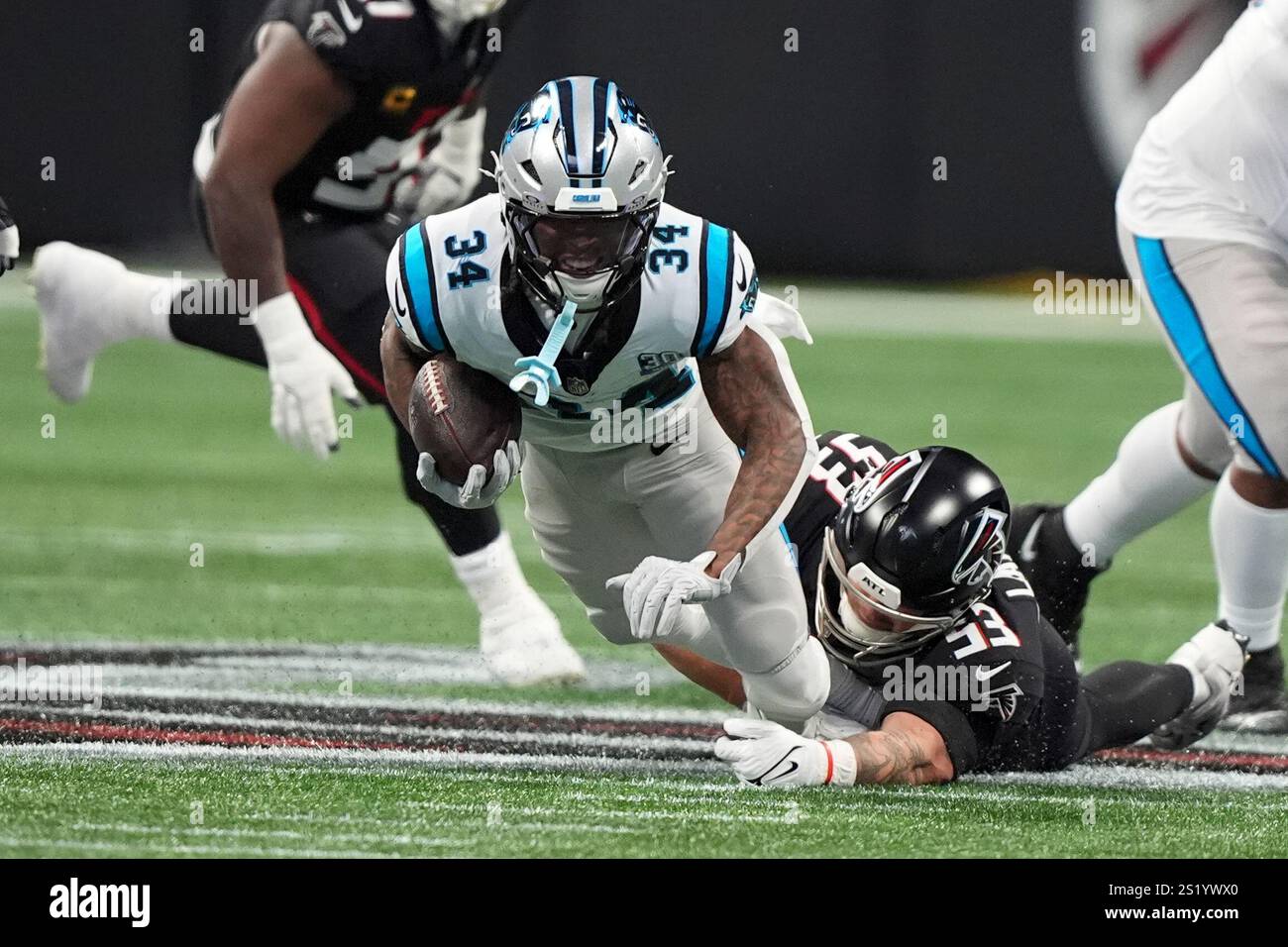 Carolina Panthers running back Mike Boone is tackled by is tackled by ...