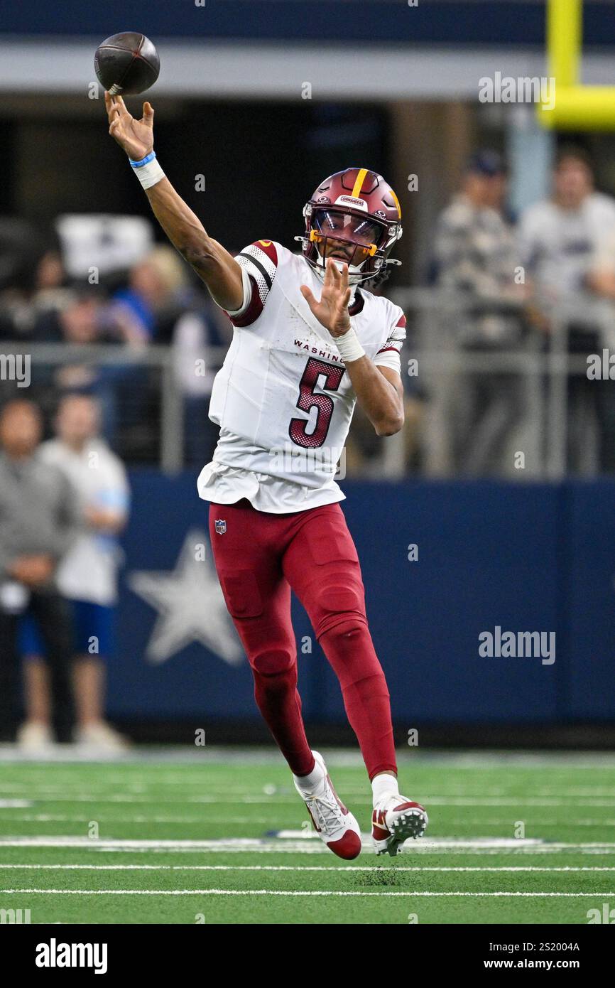 Washington Commanders quarterback Jayden Daniels throws a pass against ...