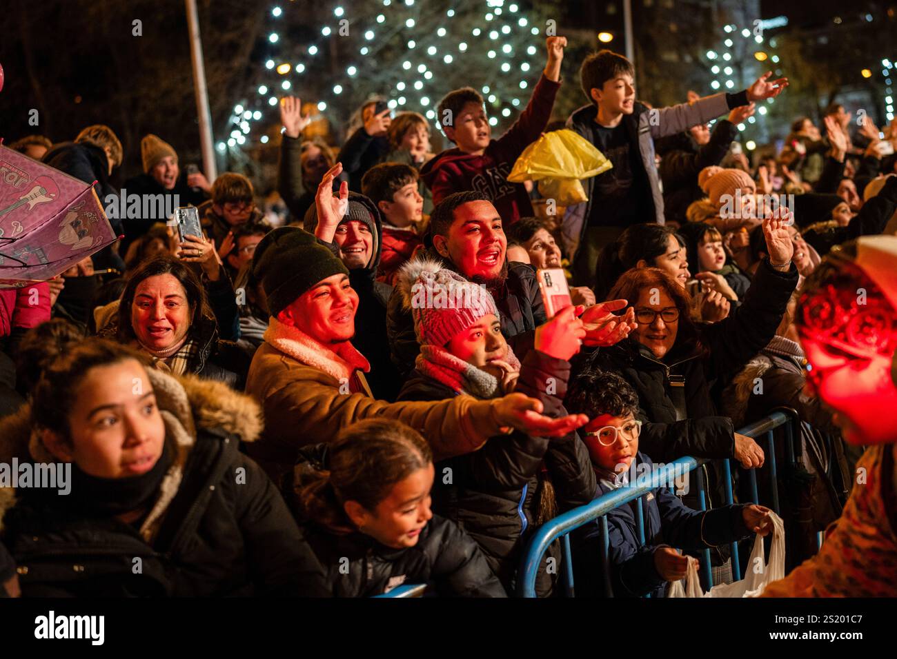 People attend the traditional "Cabalgata de Reyes" parade in Madrid ...