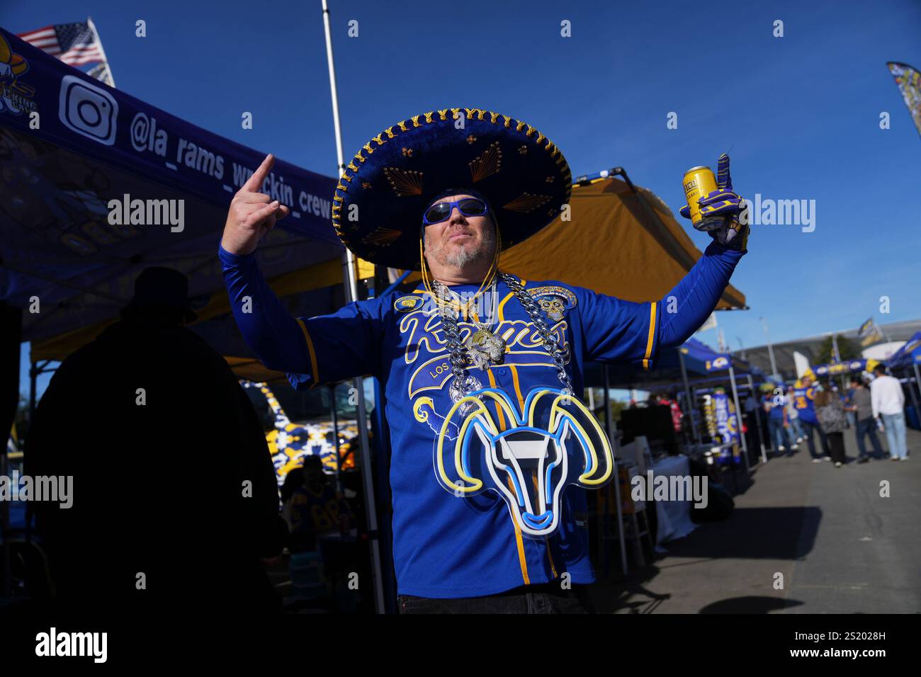 Fans tailgate before an NFL football game between the Los Angeles Rams ...