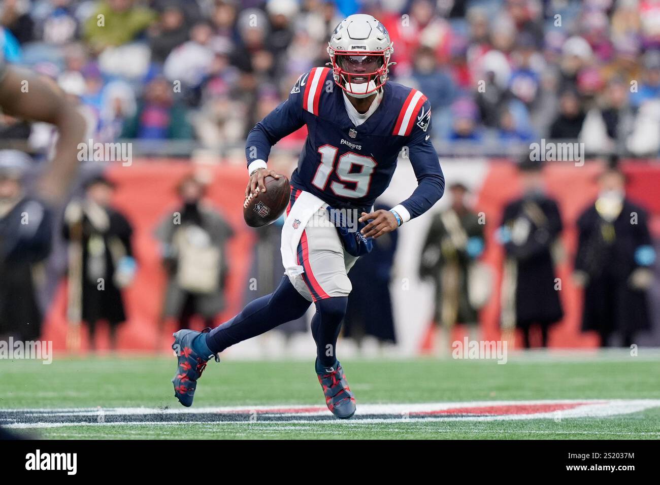 New England Patriots quarterback Joe Milton III (19) runs during the ...