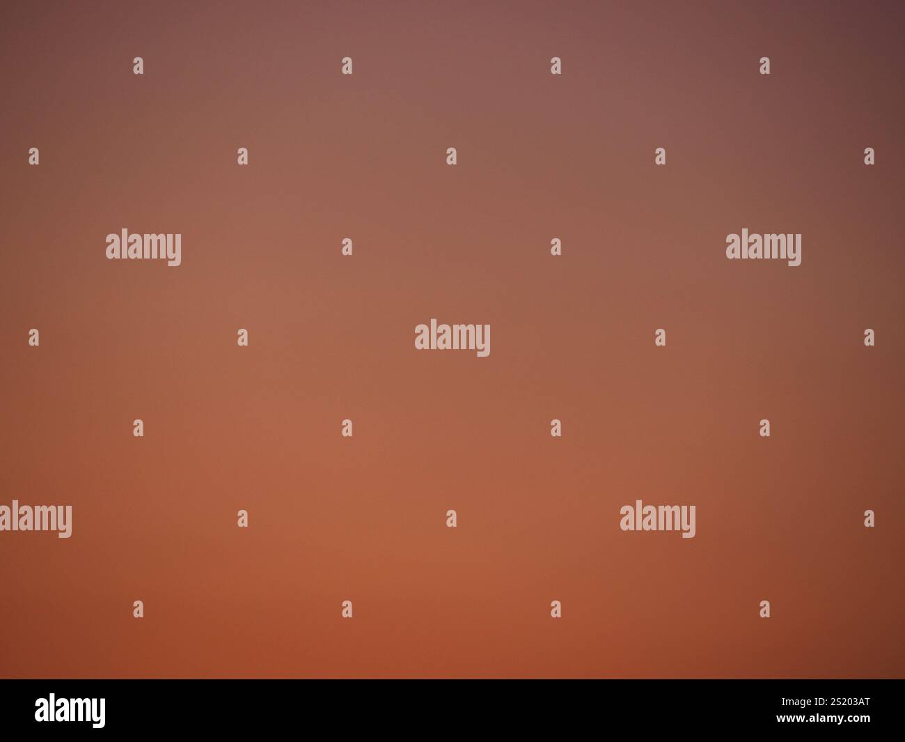 Smooth gradient of orange hue in a clear twilight sky Stock Photo - Alamy