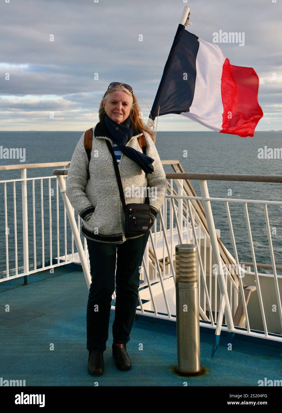 A pretty lady, aboard a cross channel ferry, in the English Channel on ...