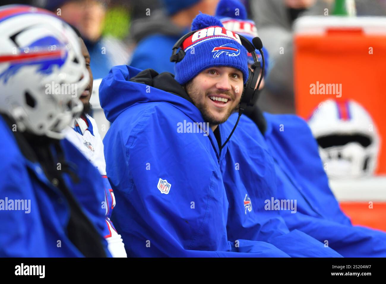 Buffalo Bills quarterback Josh Allen smiles while sitting on the bench ...