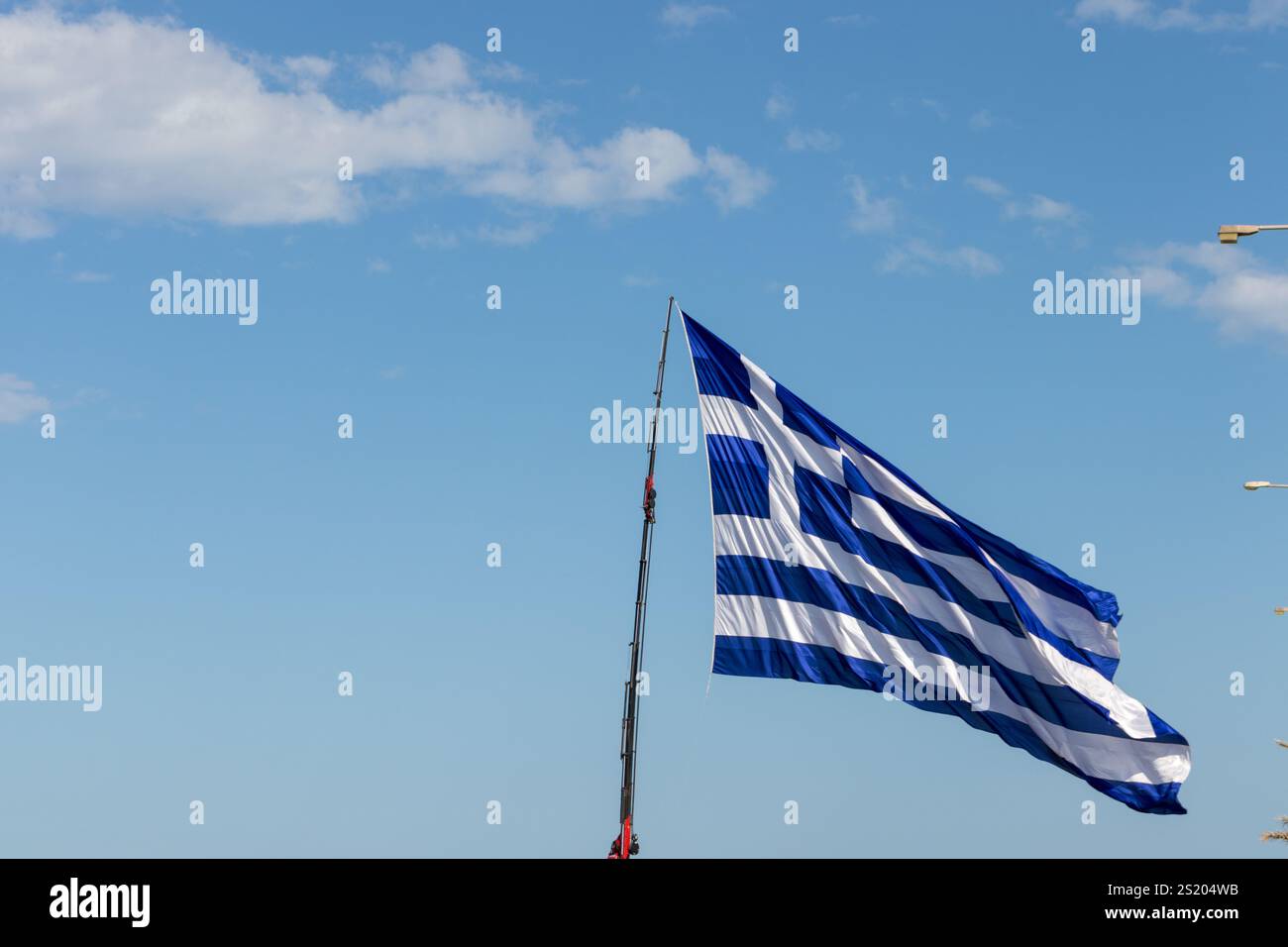 Huge Greek flag, hoisted with the help of a crane to celebrate the ...
