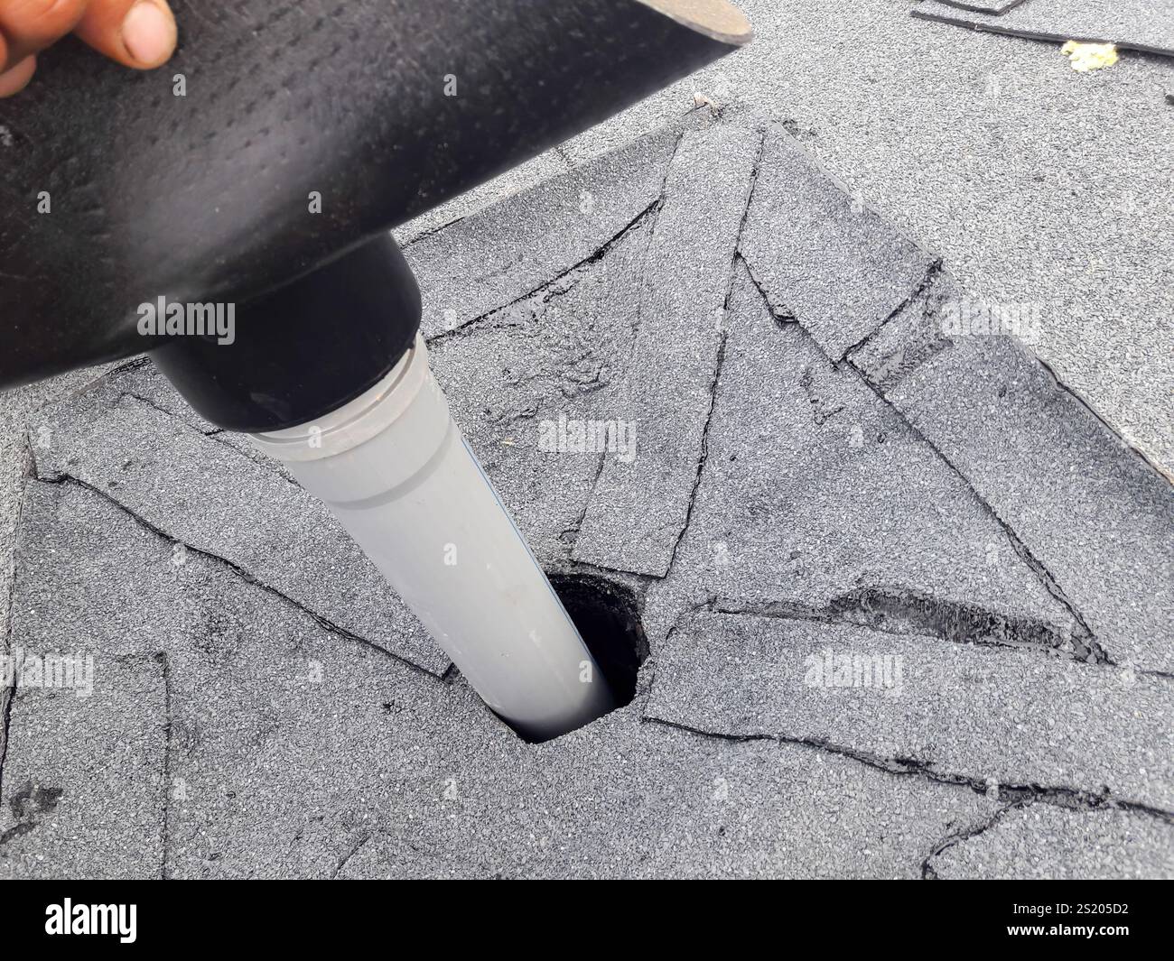 Closeup of the roof installation process, featuring drainage components ...