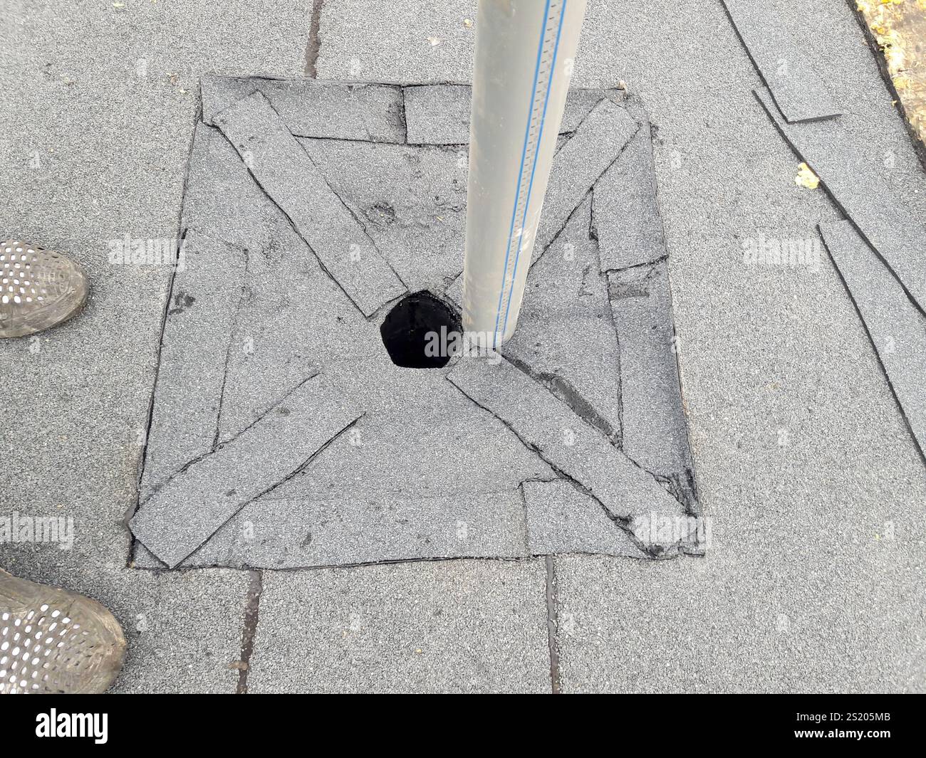 This is a closeup view captured of a pole base installation process ...