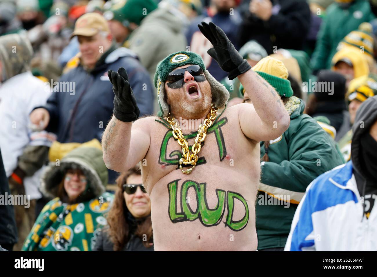 A Green Bay Packers fan cheers during the second half of an NFL ...