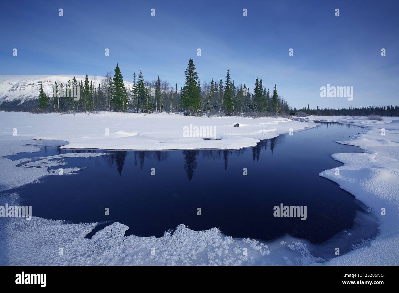 beautiful arctic winter landscape with snowy forest and frozen lake ...