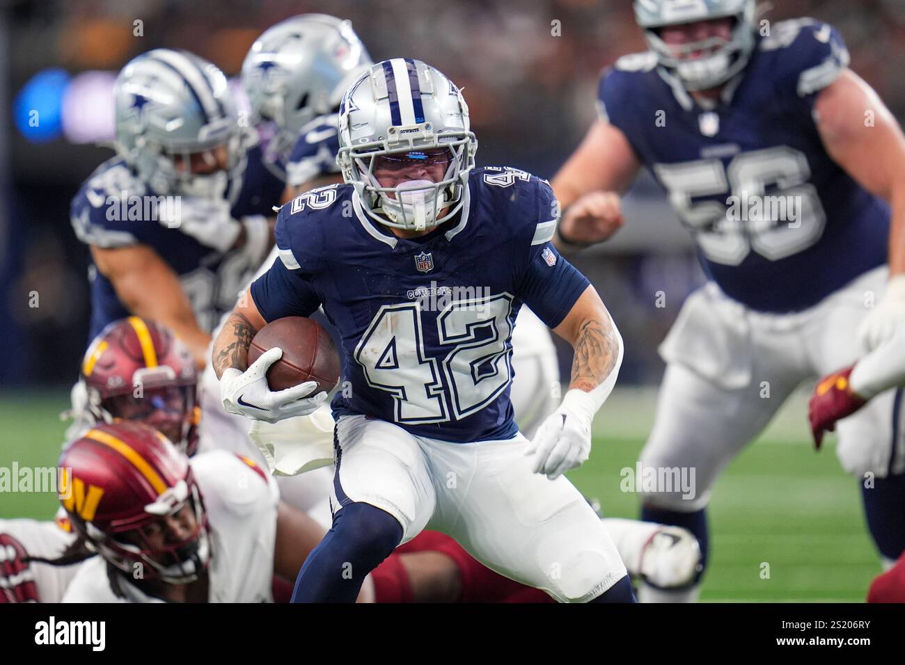 Dallas Cowboys running back Deuce Vaughn (42) runs with the ball against the Washington ...