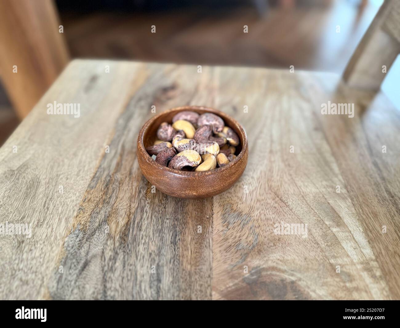 Cashew nuts . Roasted cashew nuts with shell in wooden bowl. Superfood ...