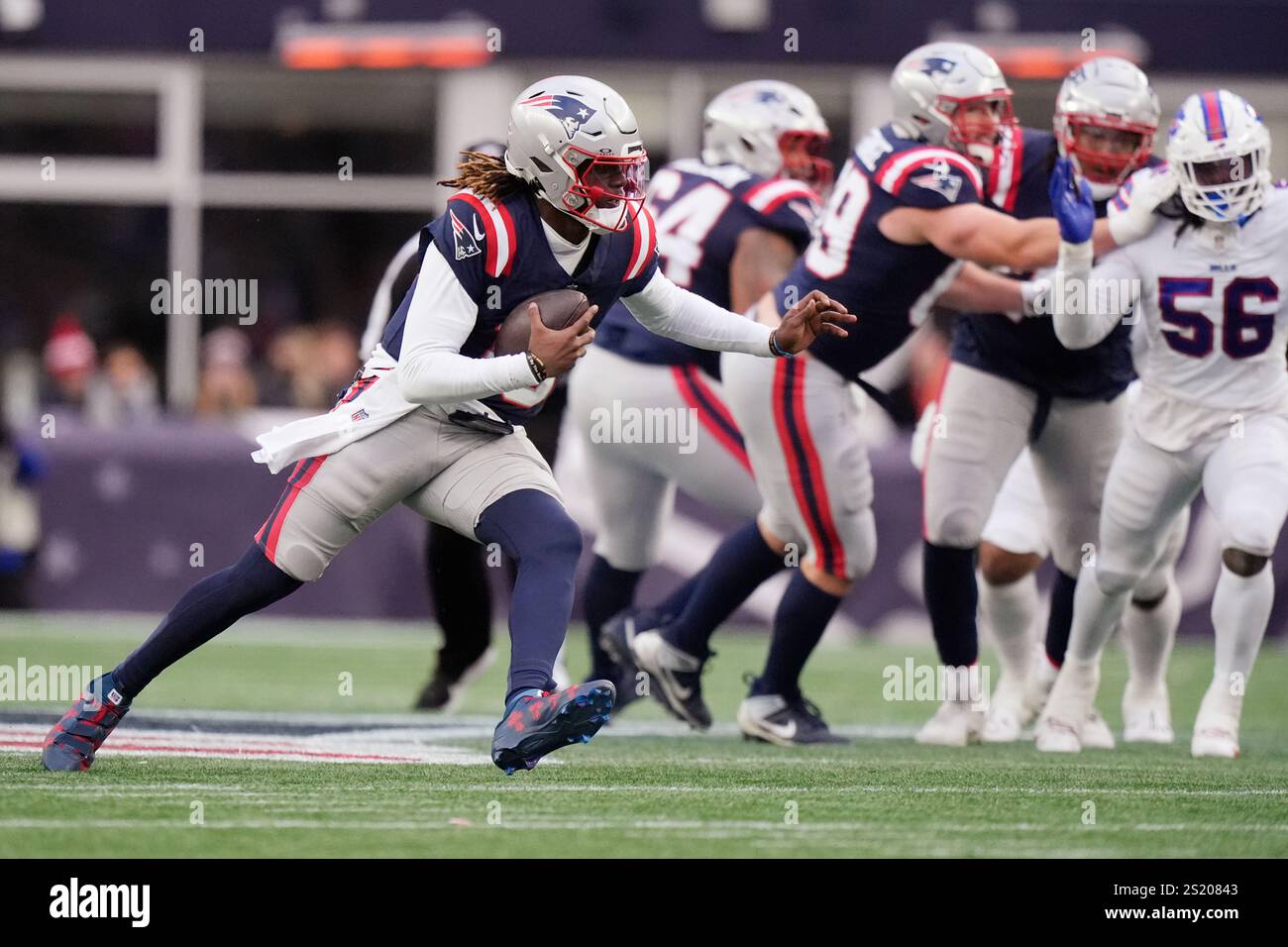 New England Patriots quarterback Joe Milton III rushes during the ...