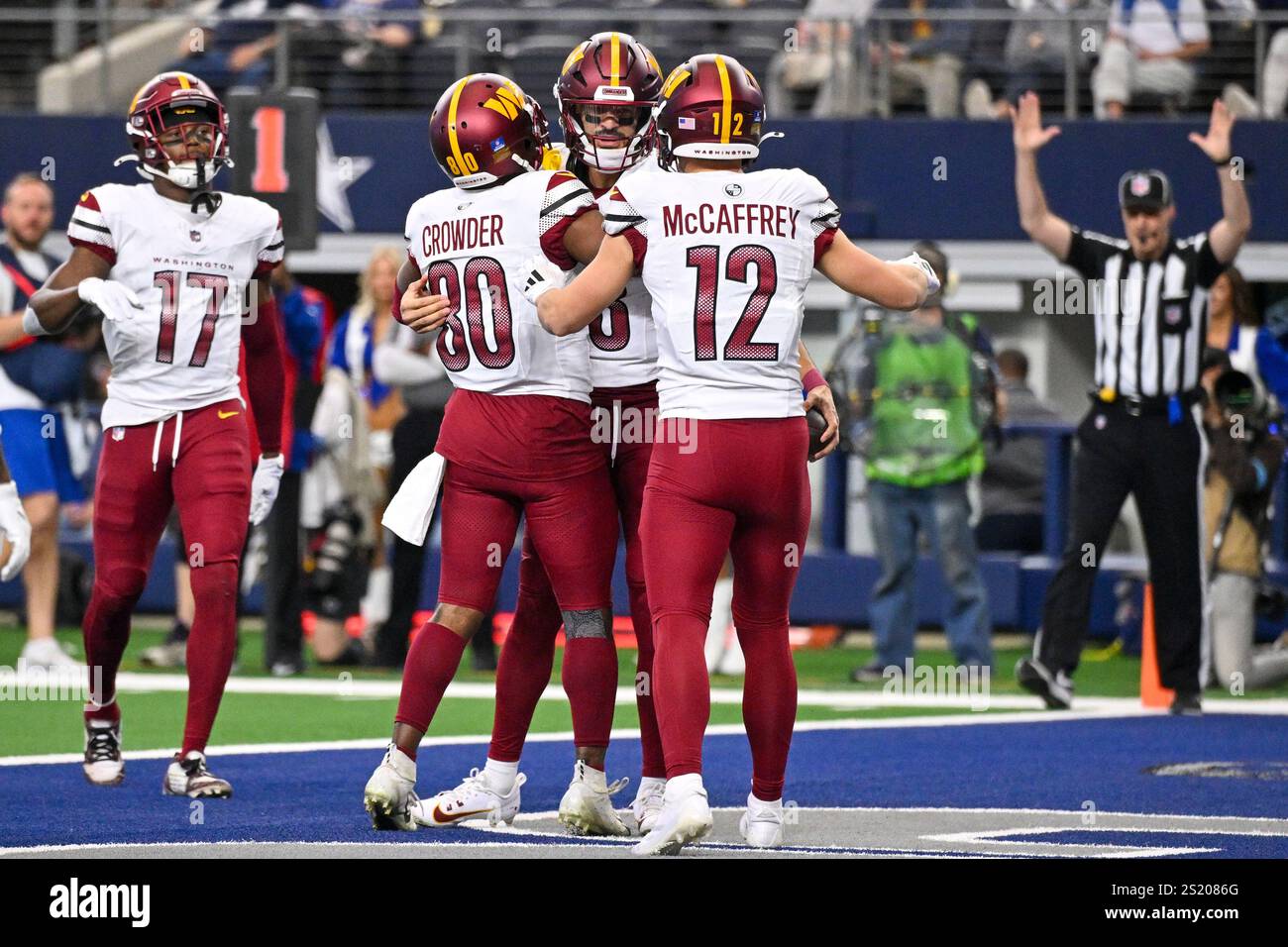 Washington Commanders quarterback Marcus Mariota, center, celebrates ...