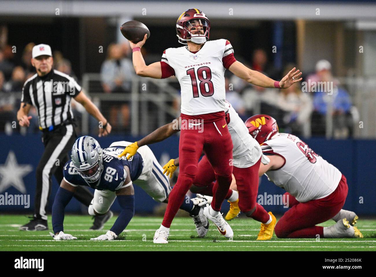 Washington Commanders quarterback Marcus Mariota (18) attempts a pass ...