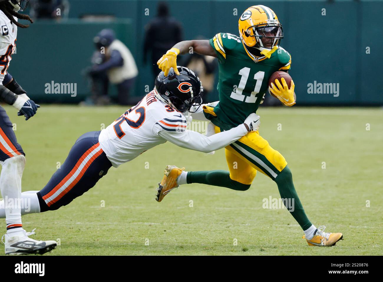 Green Bay Packers wide receiver Jayden Reed (11) runs against Chicago Bears cornerback Terell ...