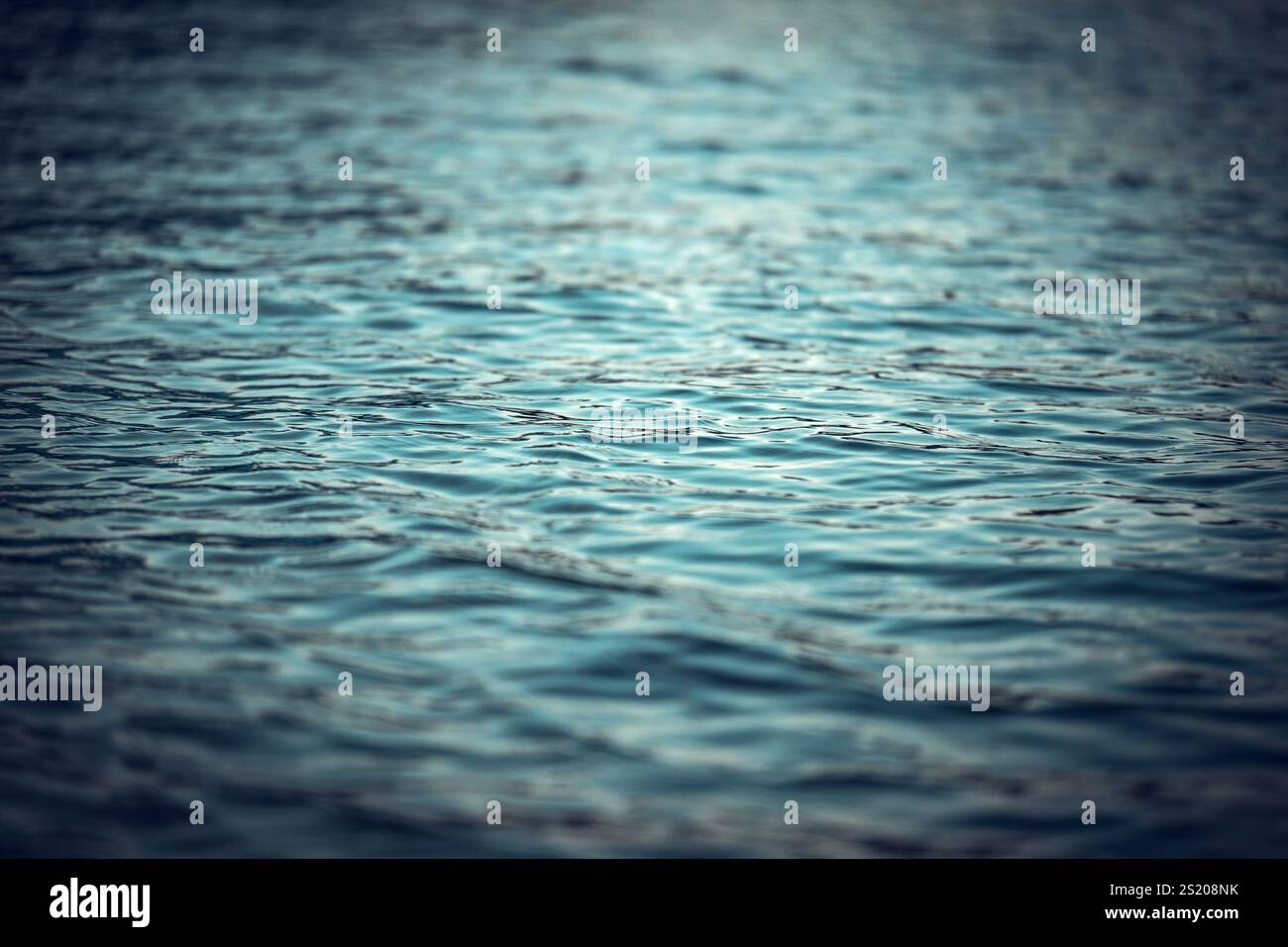 Water as a background. A single-color background of blue water with ...