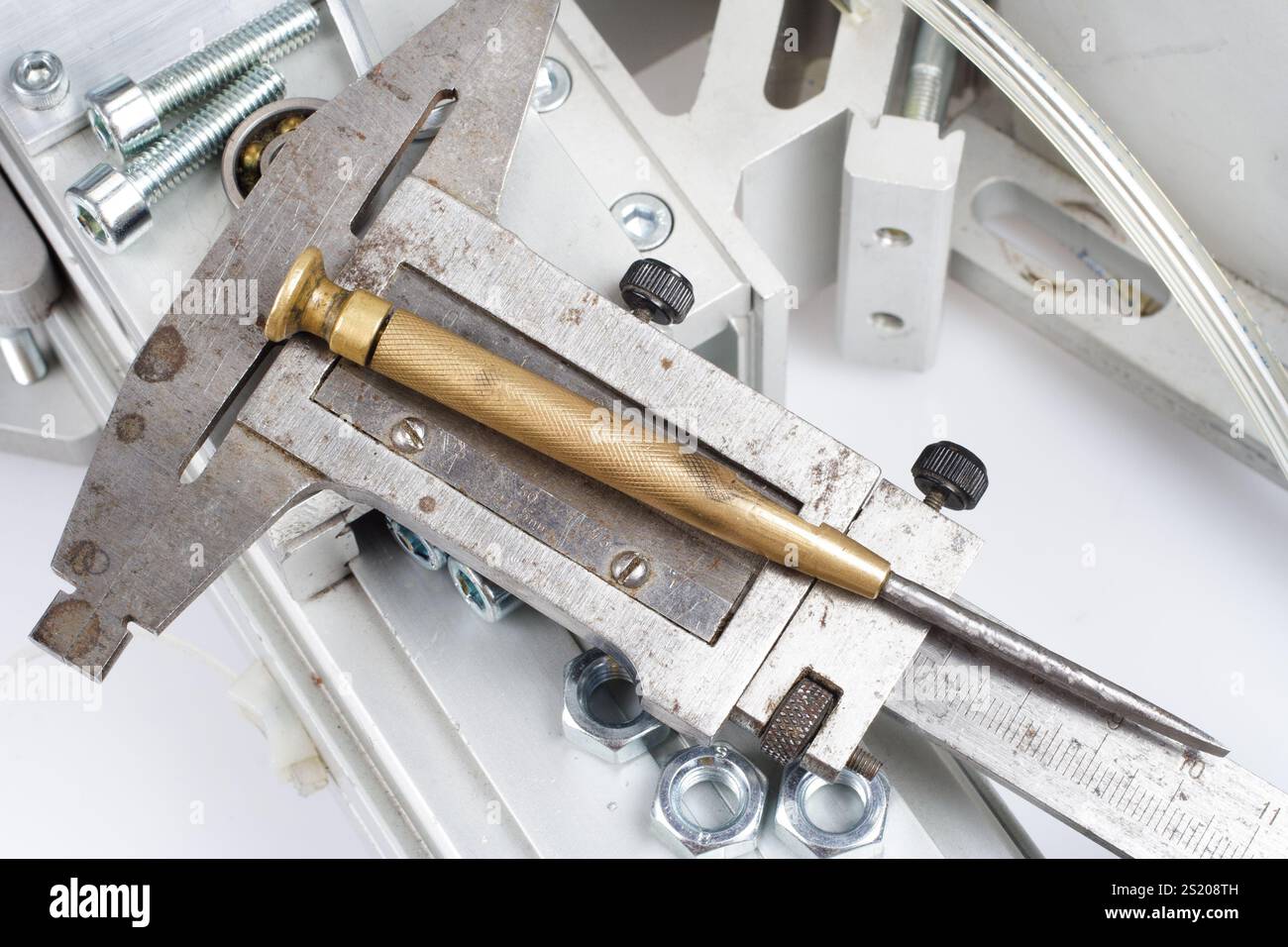 Vernier caliper and screwdriver on industry machinery background Stock ...