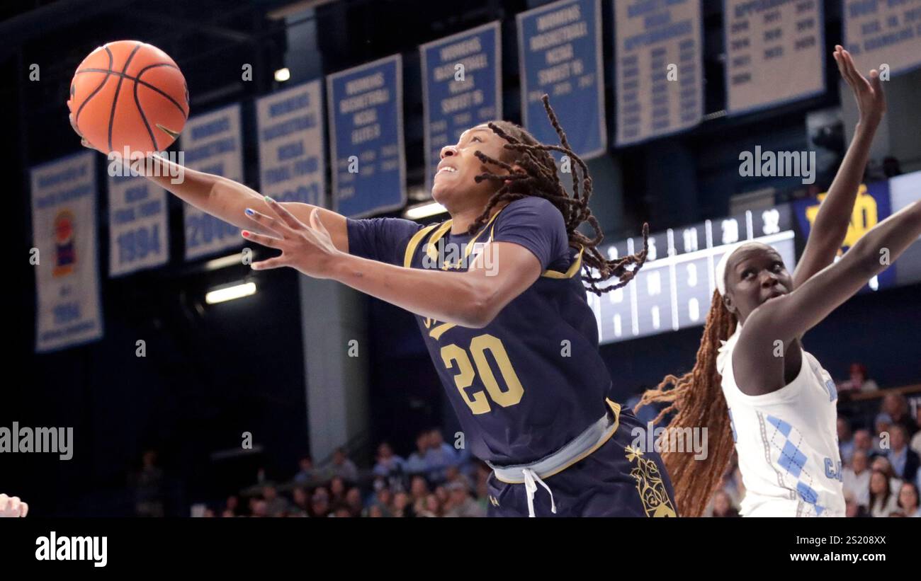 Notre Dame forward Liatu King (20) drives past North Carolina forward ...