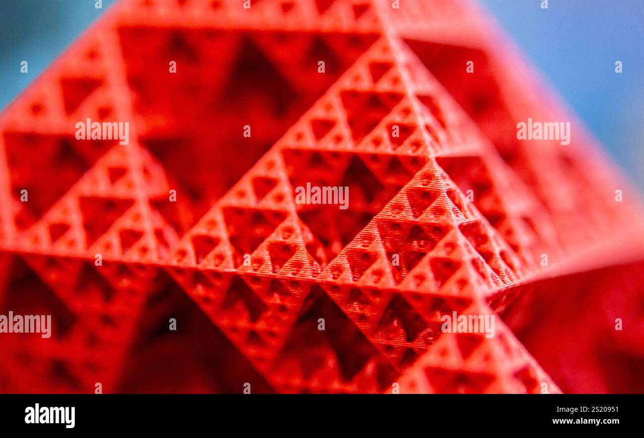 Art object printed on 3D printer from red melted plastic close-up ...