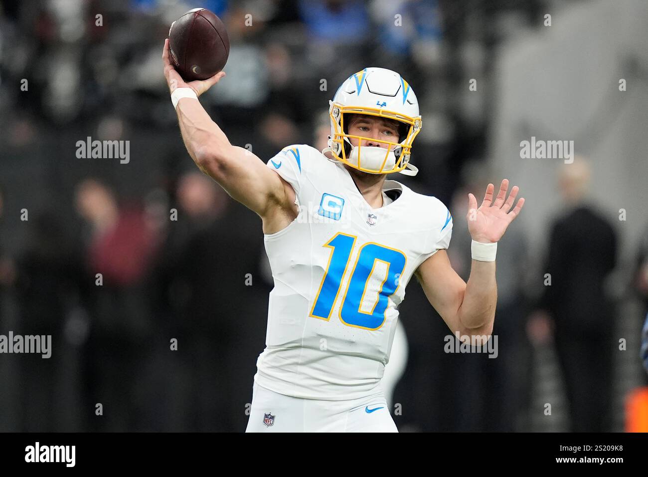 Los Angeles Chargers quarterback Justin Herbert (10) warms up before an ...